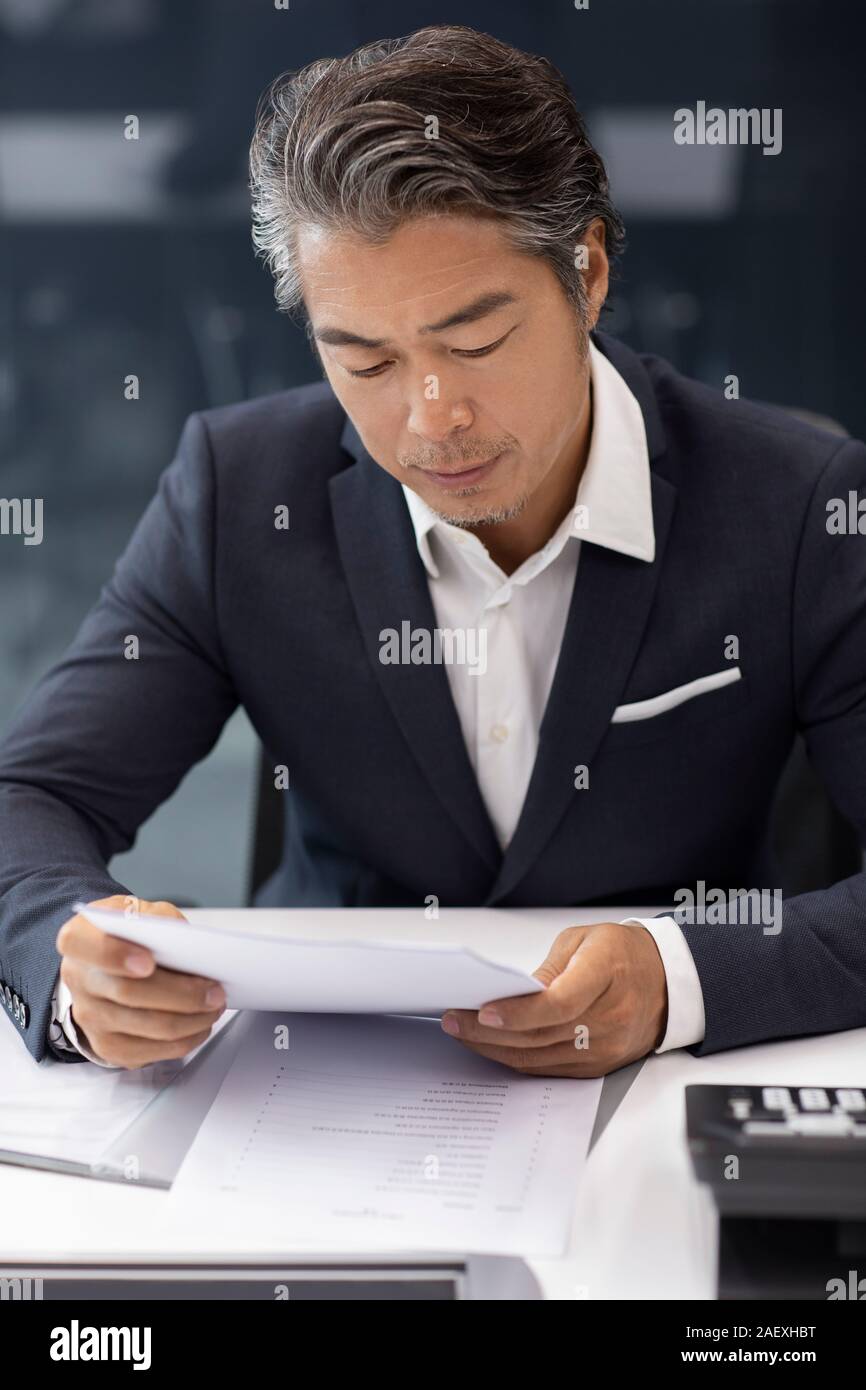 Sitting holding reading concentration authority hi-res stock ...