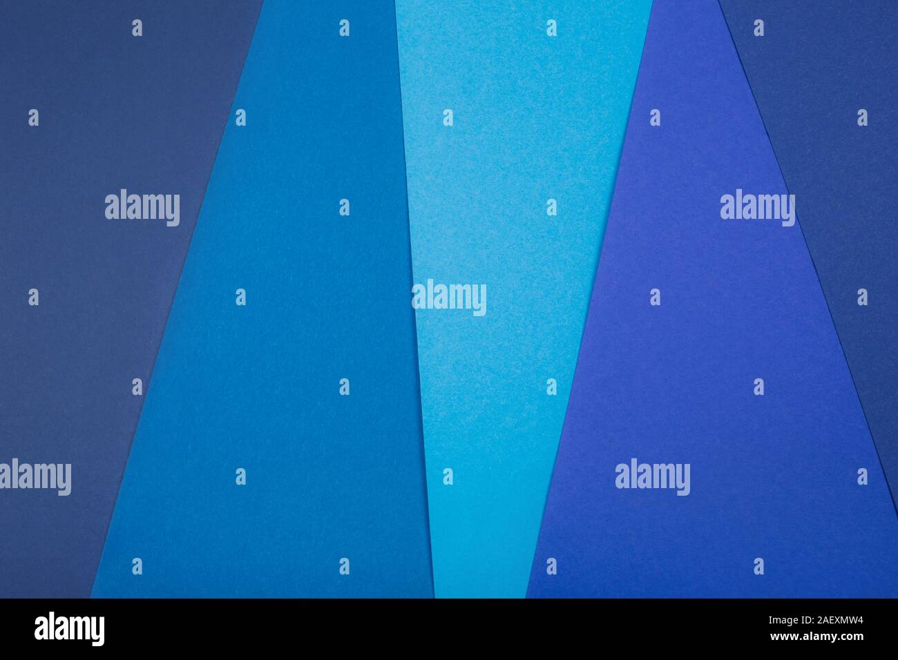 Divided in several parts blue paper background with metallic elemments ...