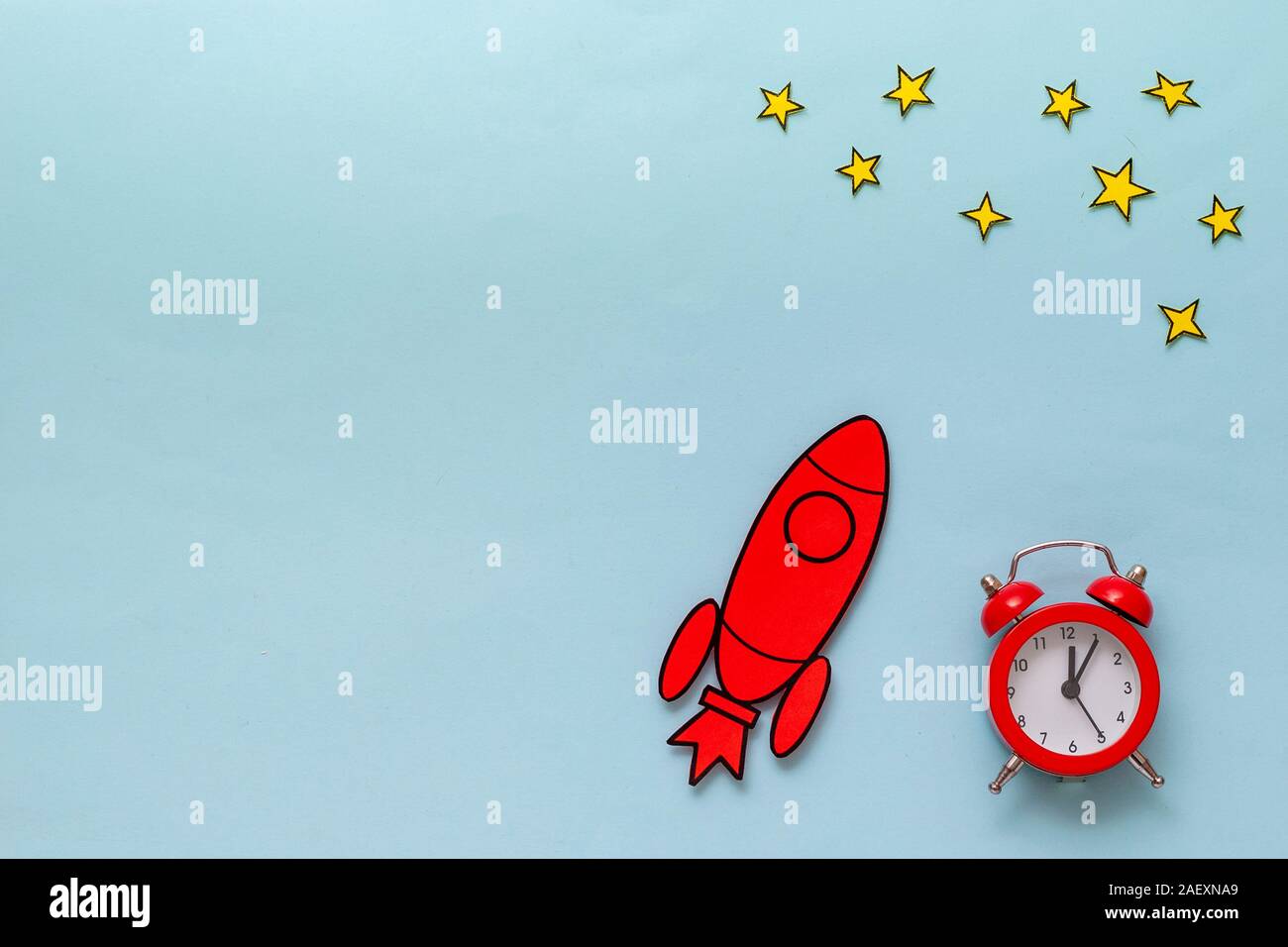 Red cartoon rocket with alarm clock and stars Stock Photo - Alamy