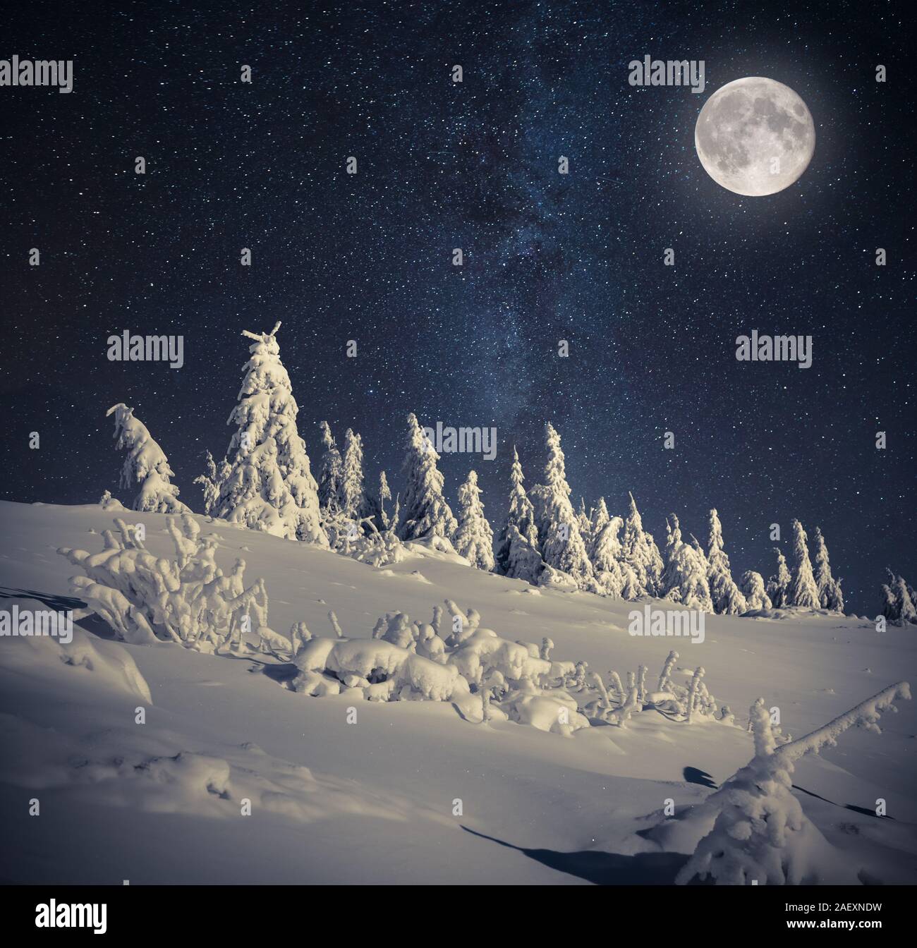 Full moon in night sky in the winter mountains Stock Photo - Alamy