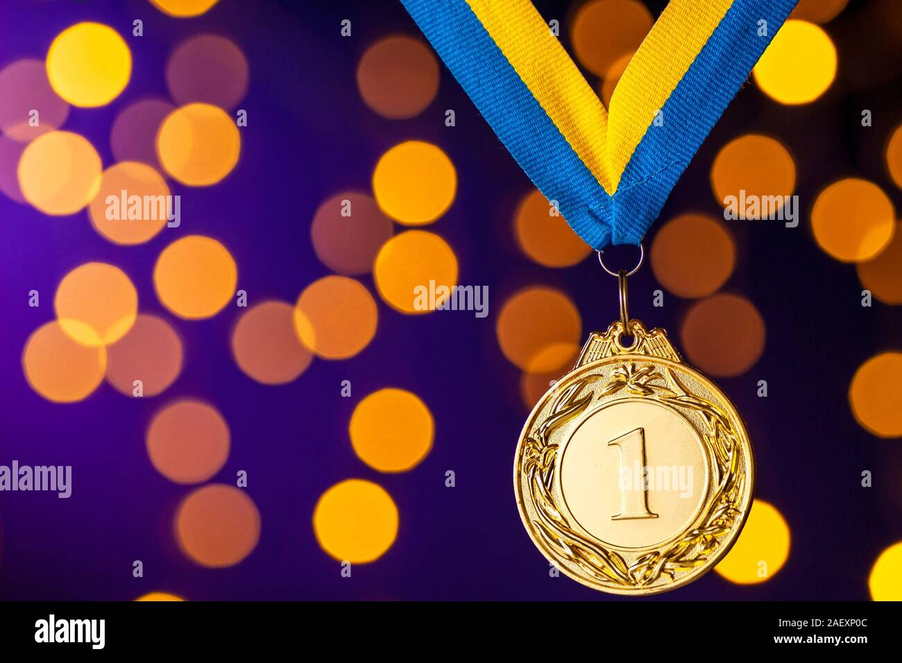 Gold champion or winners medallion on a ribbon Stock Photo - Alamy