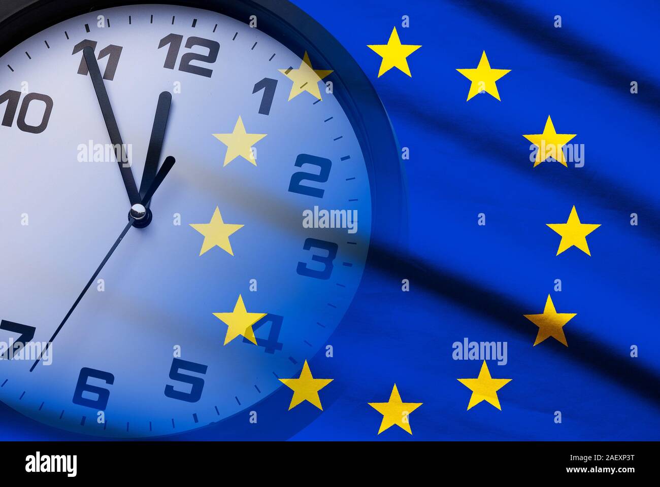 Composite of the EU flag and dial of a clock Stock Photo - Alamy