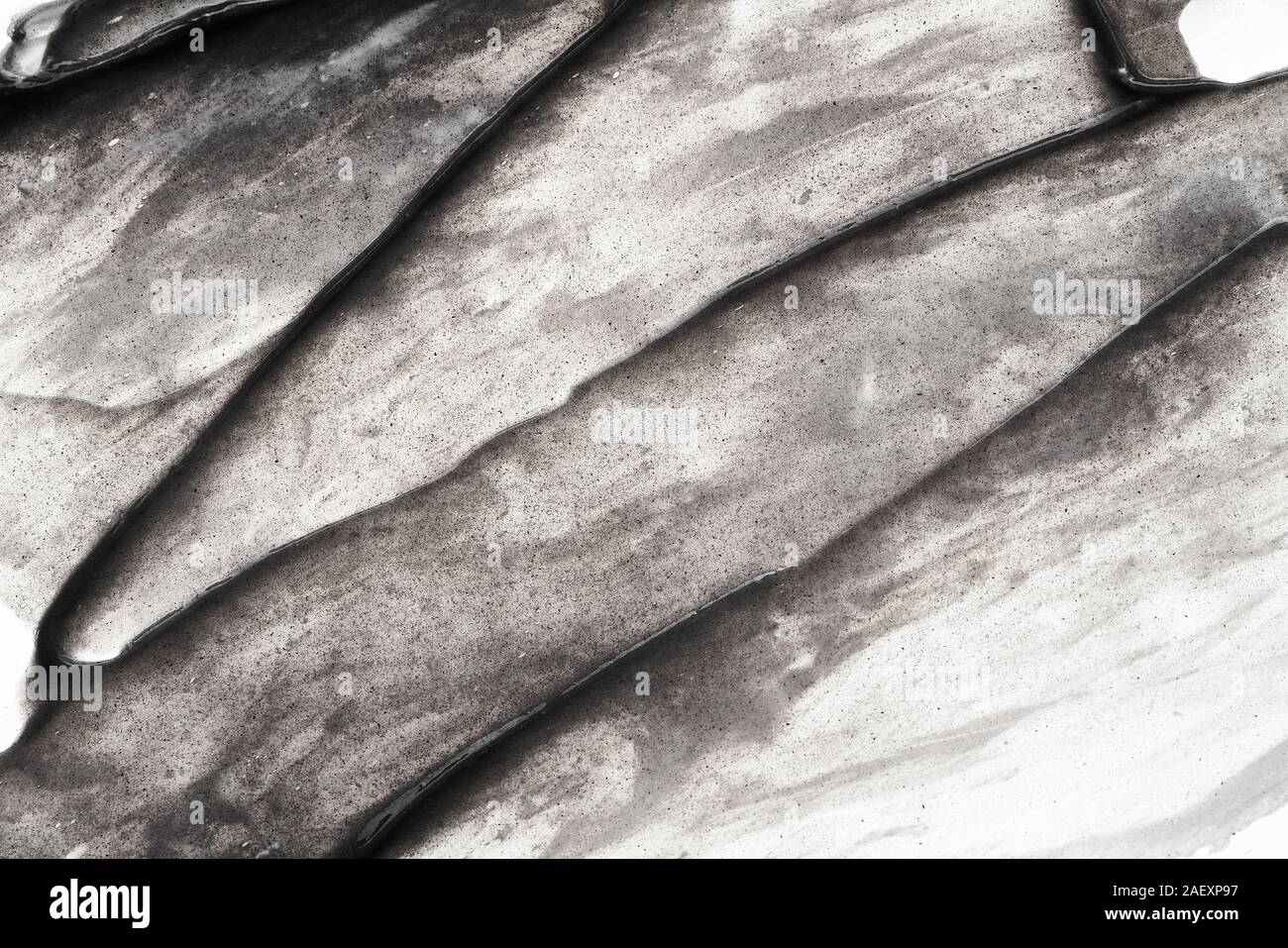 Brush strokes and texture of black detox facial mask or acrylic paint ...