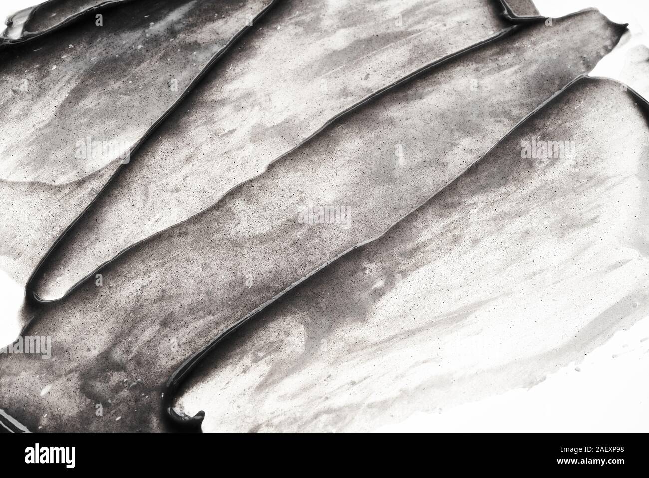 Brush strokes and texture of black detox facial mask or acrylic paint ...