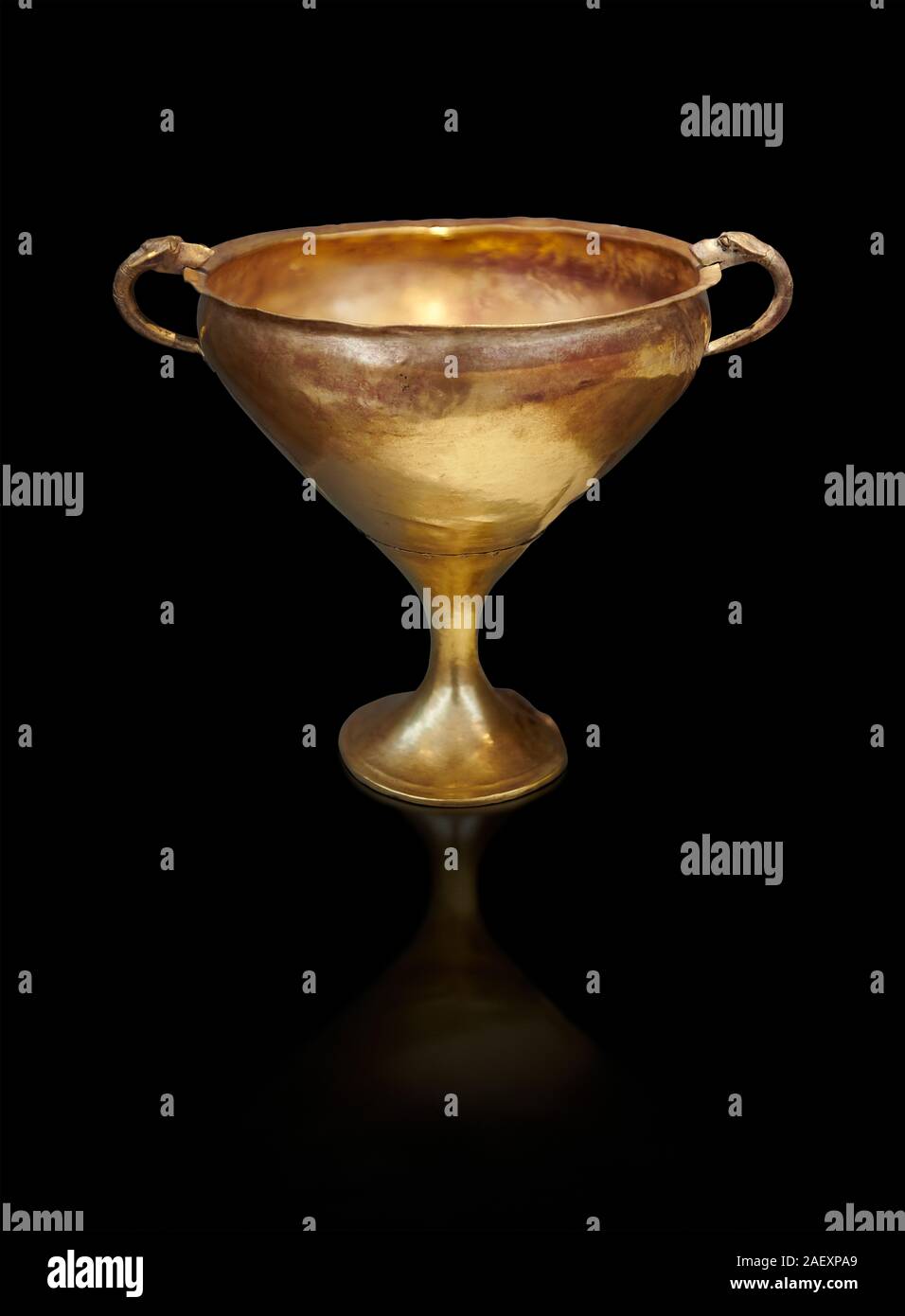 Mycenaean gold goblet with two handles ening with a dogs head biting ...