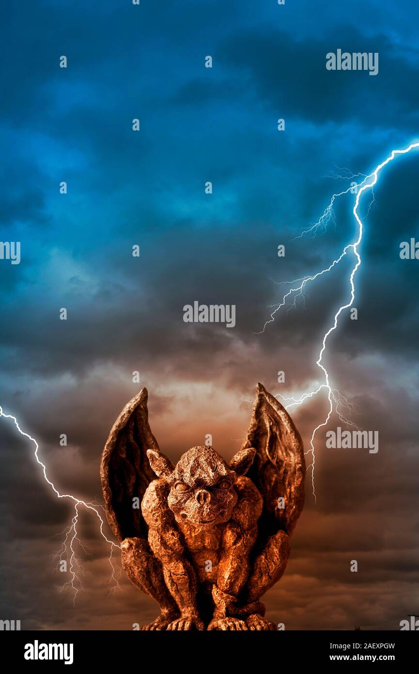 winged Gargoyle over a dramatic background with lightning Stock Photo ...