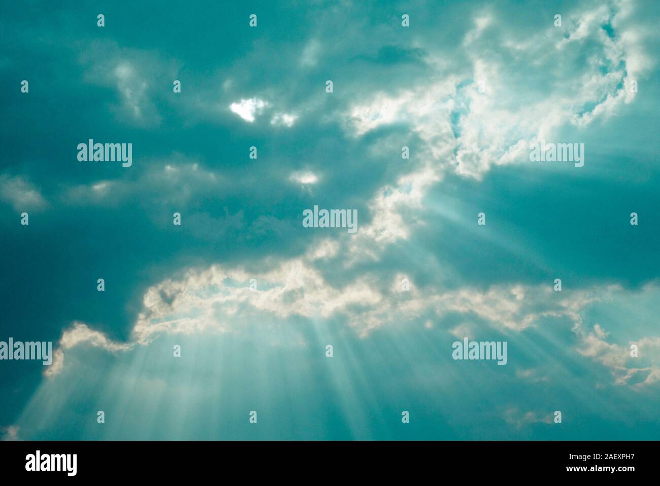 divine sky with clouds and rays of sun from behind it Stock Photo - Alamy