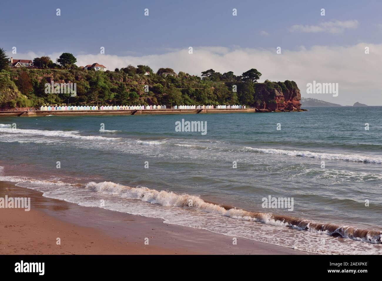 Goodrington beach, and beach huts beneath Roundham Head, Torbay, Devon ...