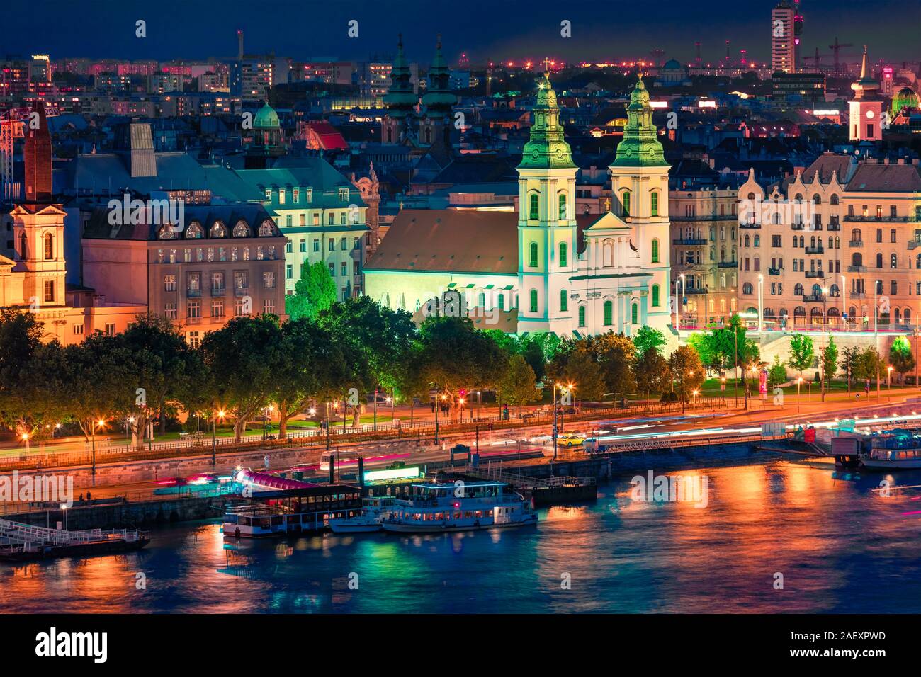 Colorful night view of Inner City parish Church in Pest city. Splendid ...