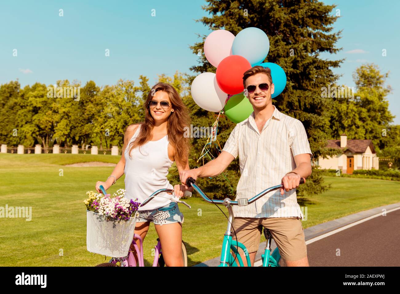 happy couple in love ride bicycles have fun Stock Photo - Alamy