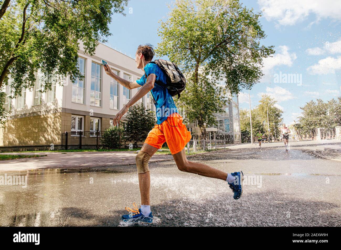 Athletic male on phone hi-res stock photography and images - Alamy