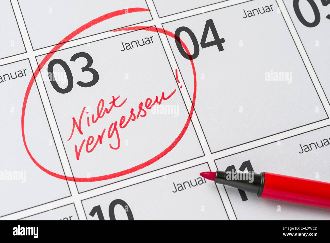 Save the Date written on a calendar - January 03 - Nicht vergessen in ...