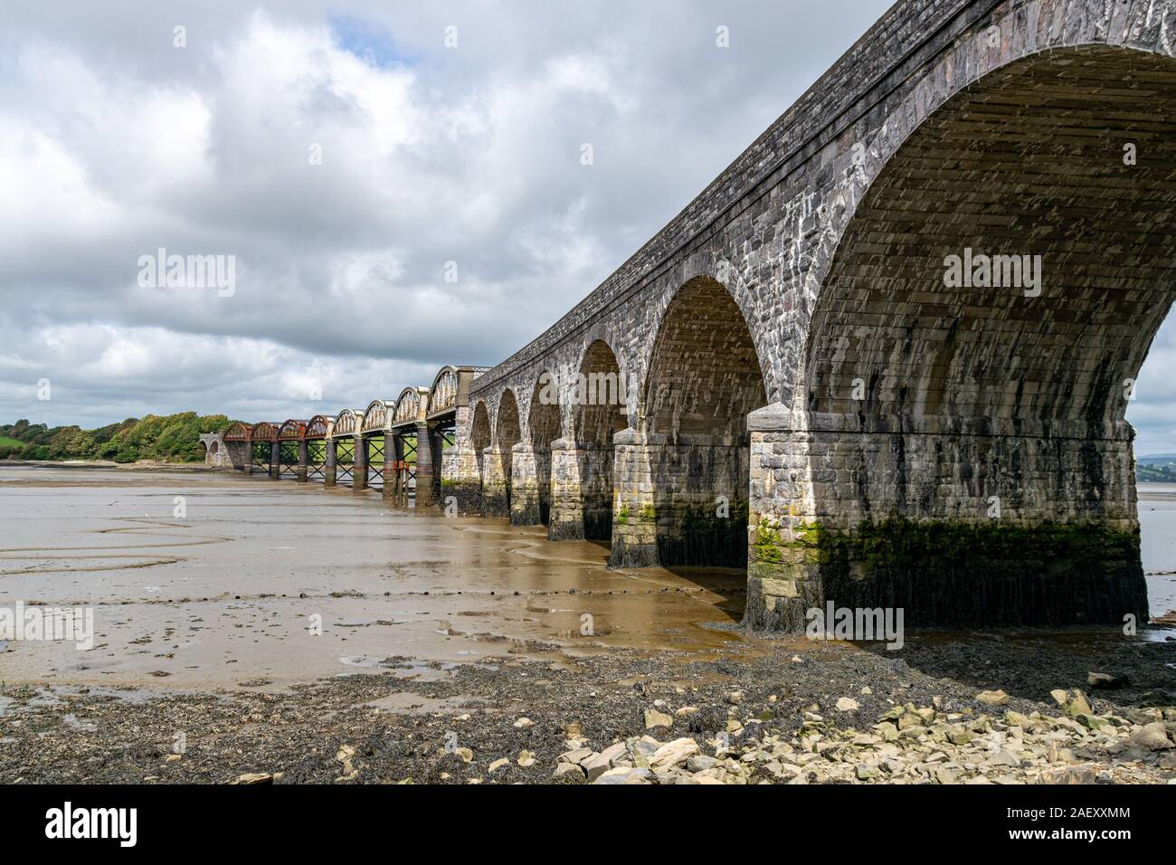 Mud flats underneath the railway bridge crossing the River Tavy at low ...