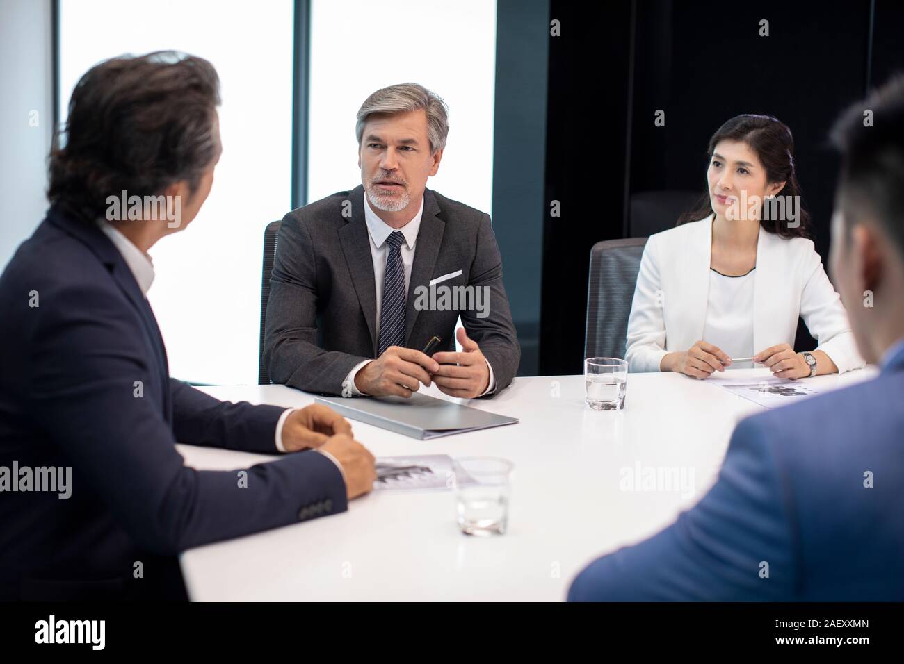 Business people talking in conference room Stock Photo - Alamy