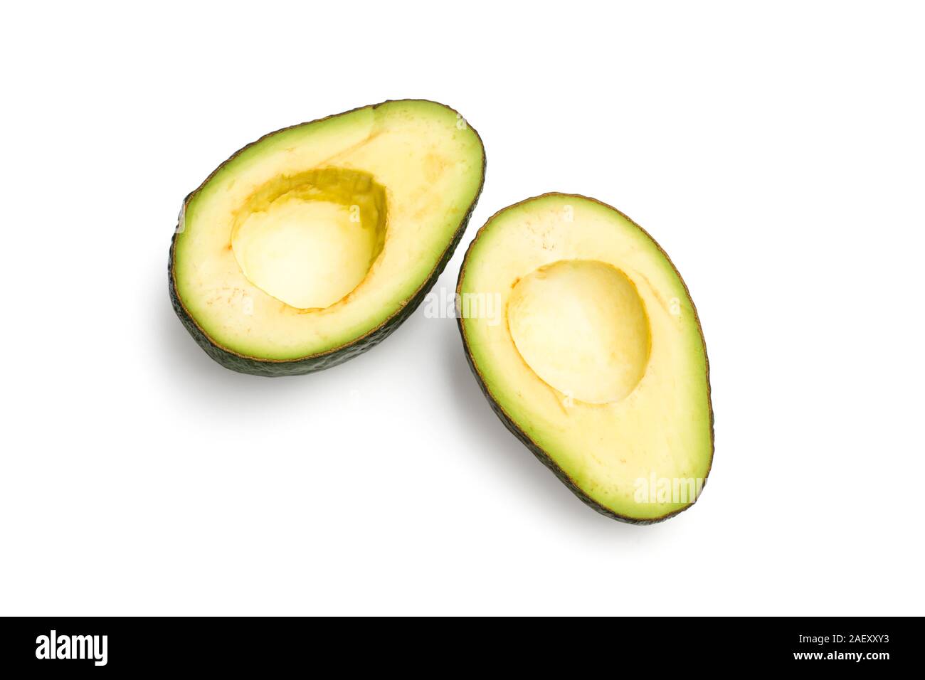 Halved avocado without seed on a white background Stock Photo - Alamy