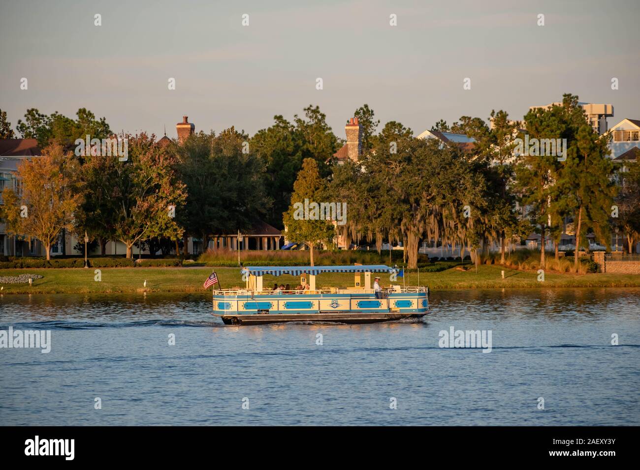 Orlando, Florida. November 29, 2019.Taxi boat sailing at blue lake in ...