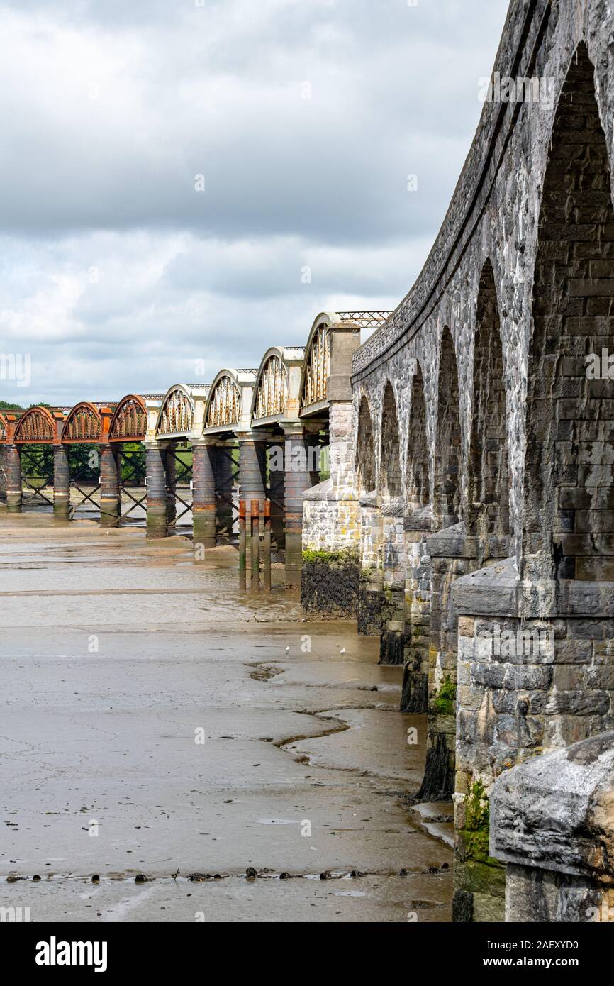Mud flats underneath the railway bridge crossing the River Tavy at low ...