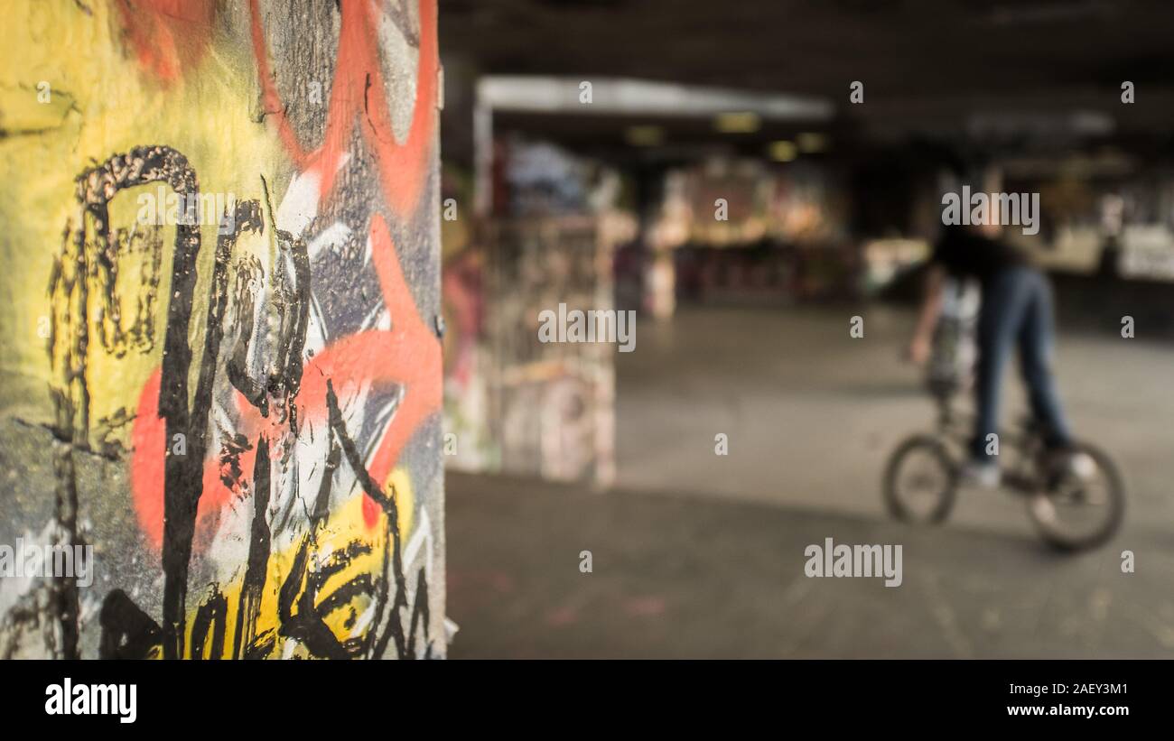 BMX Park. An urban concrete area adorned with graffiti and turned into ...