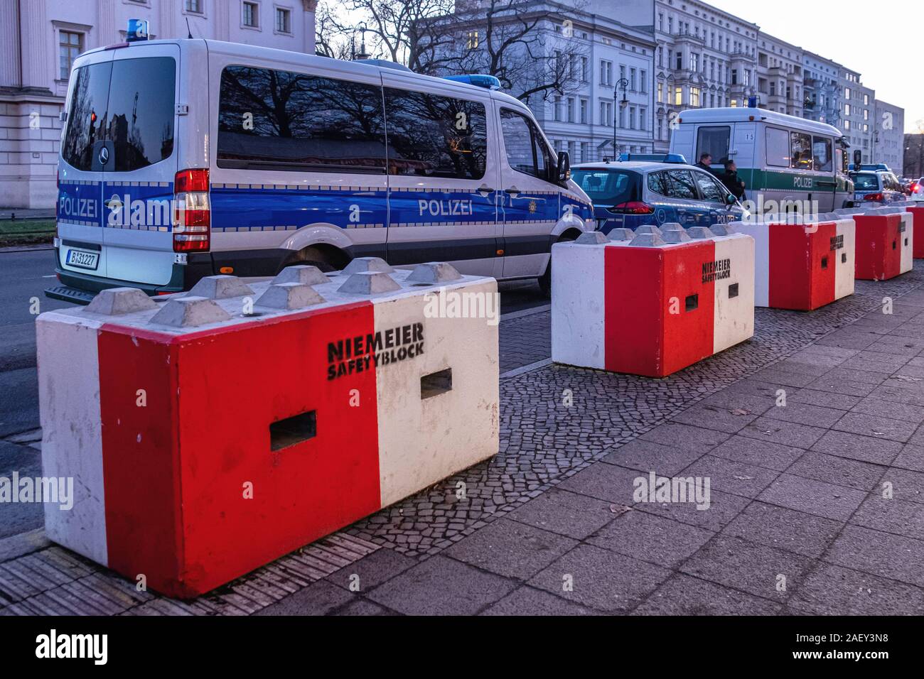 Concrete safety Bollards & Police vans outside Traditional German ...