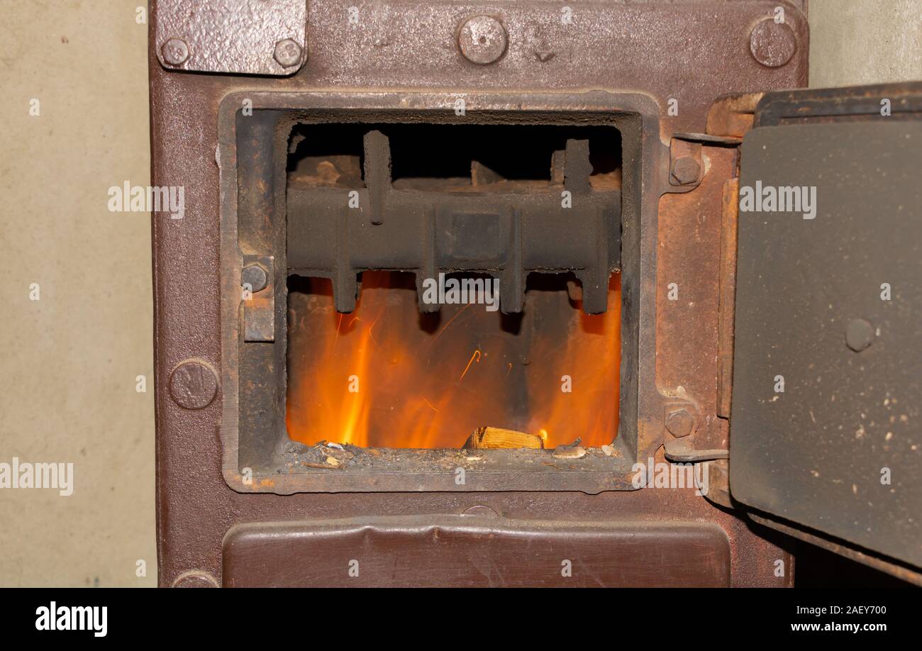 The fire burns in the stove winter home heating concept Stock Photo - Alamy
