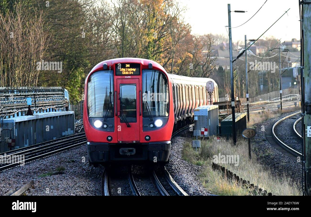 A district line tube train in London Stock Photo - Alamy
