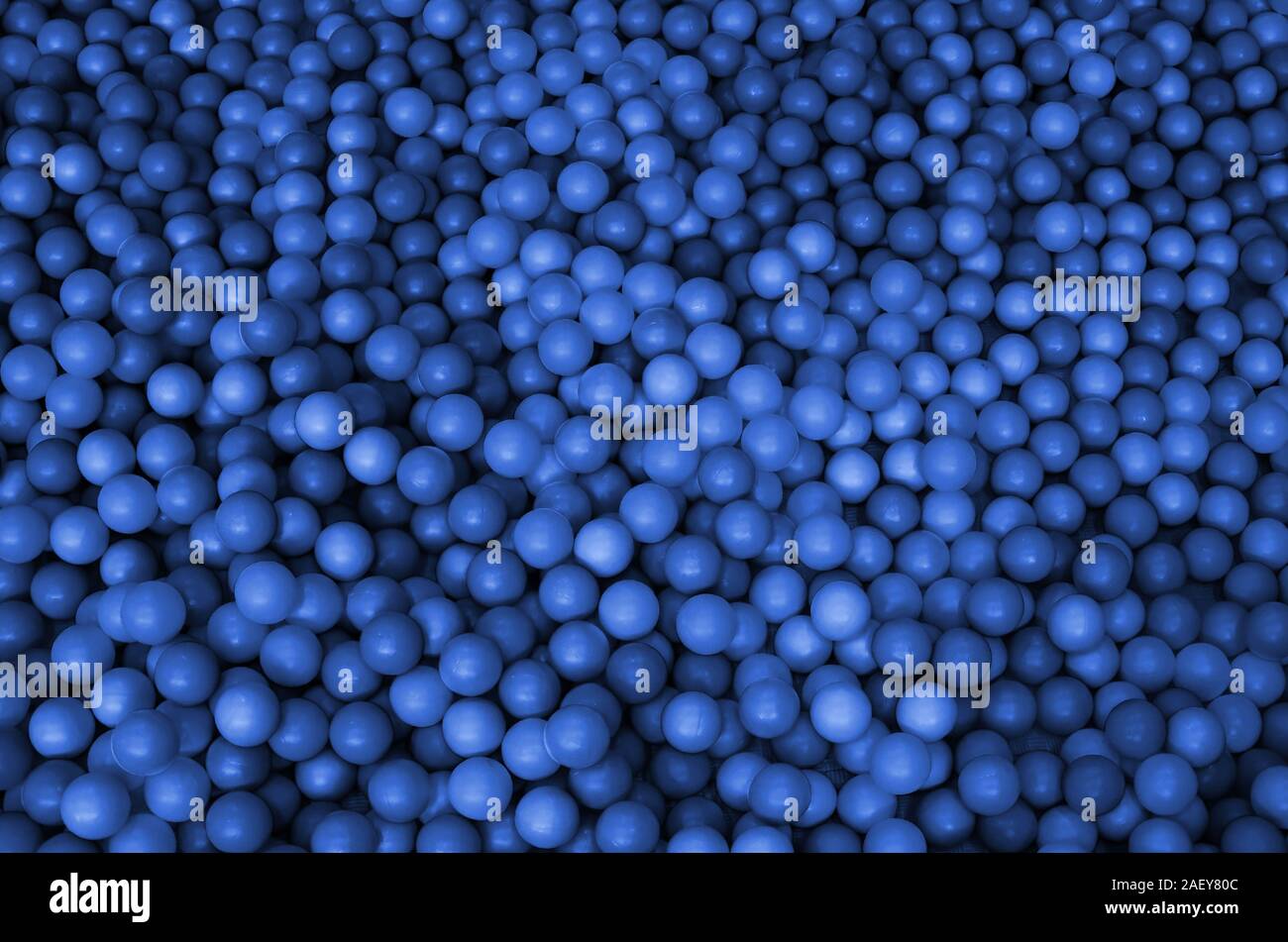 Many plastic balls in a kids ballpit at a playground. Close up pattern ...
