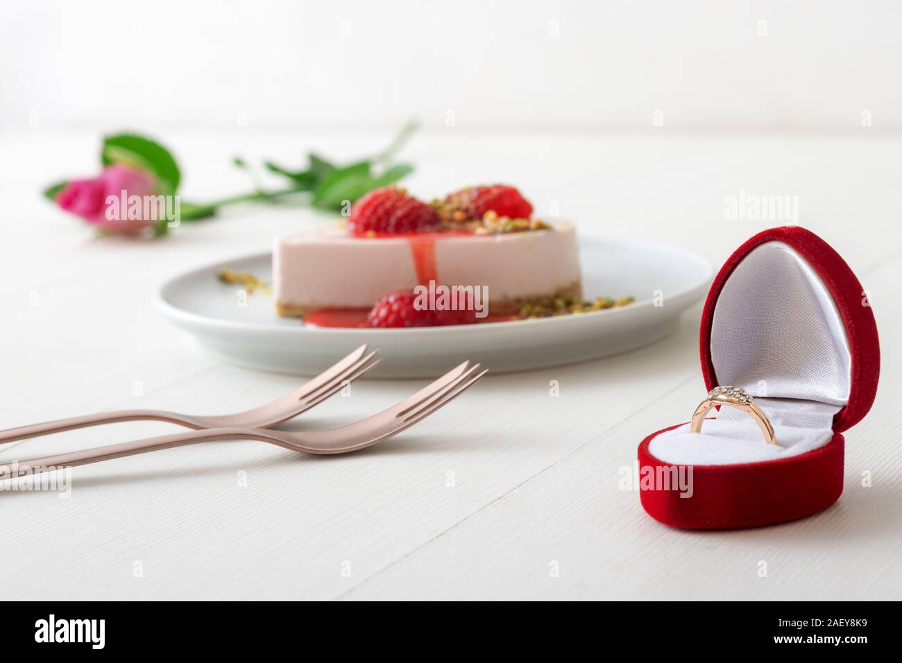 White wooden table with mini cheesecake dessert embellished with real ...
