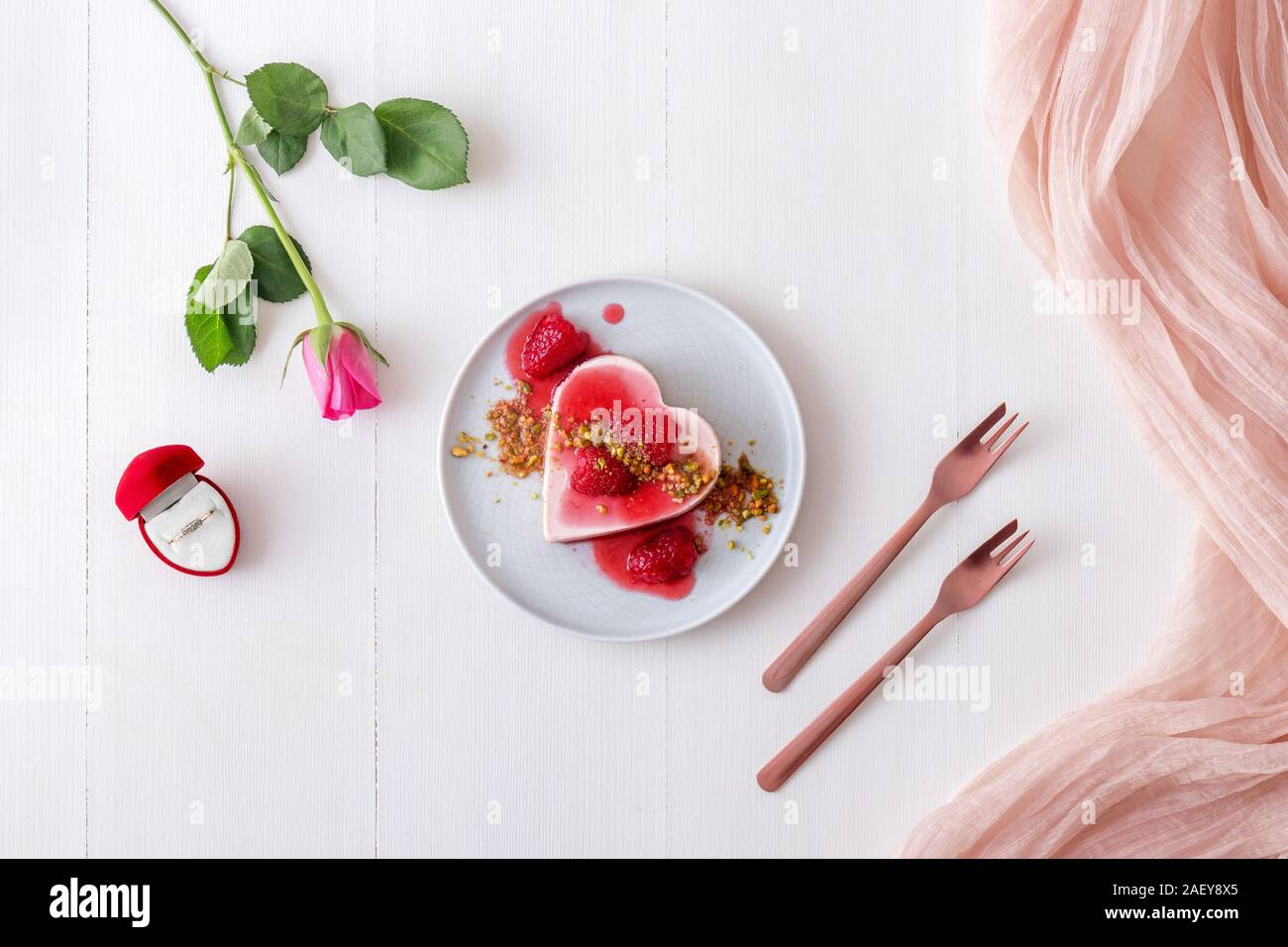 White wooden table with mini cheescake dessert embellished with real ...