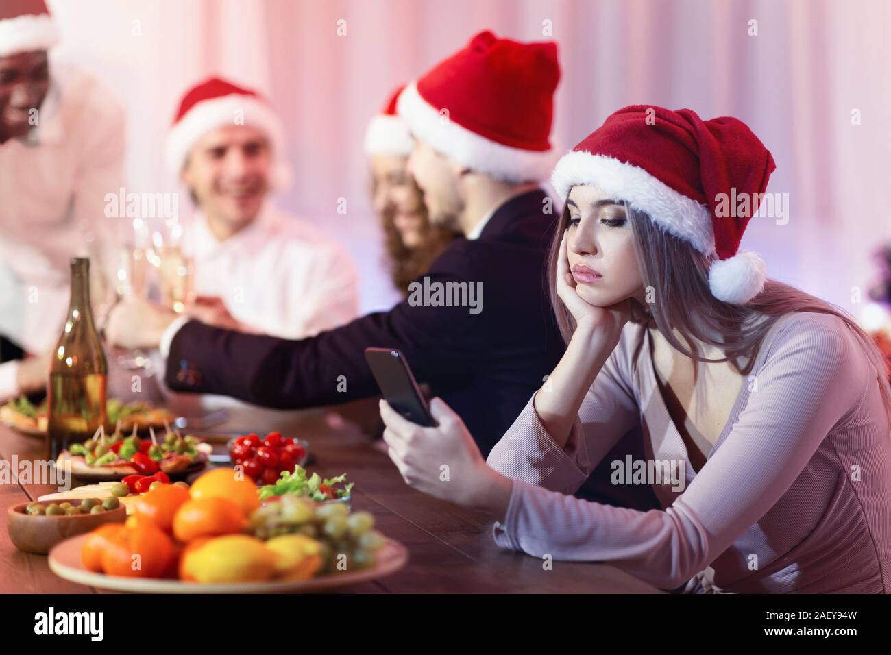 Boring New Year Party. Sad Girl Texting On Phone During Dreadful ...