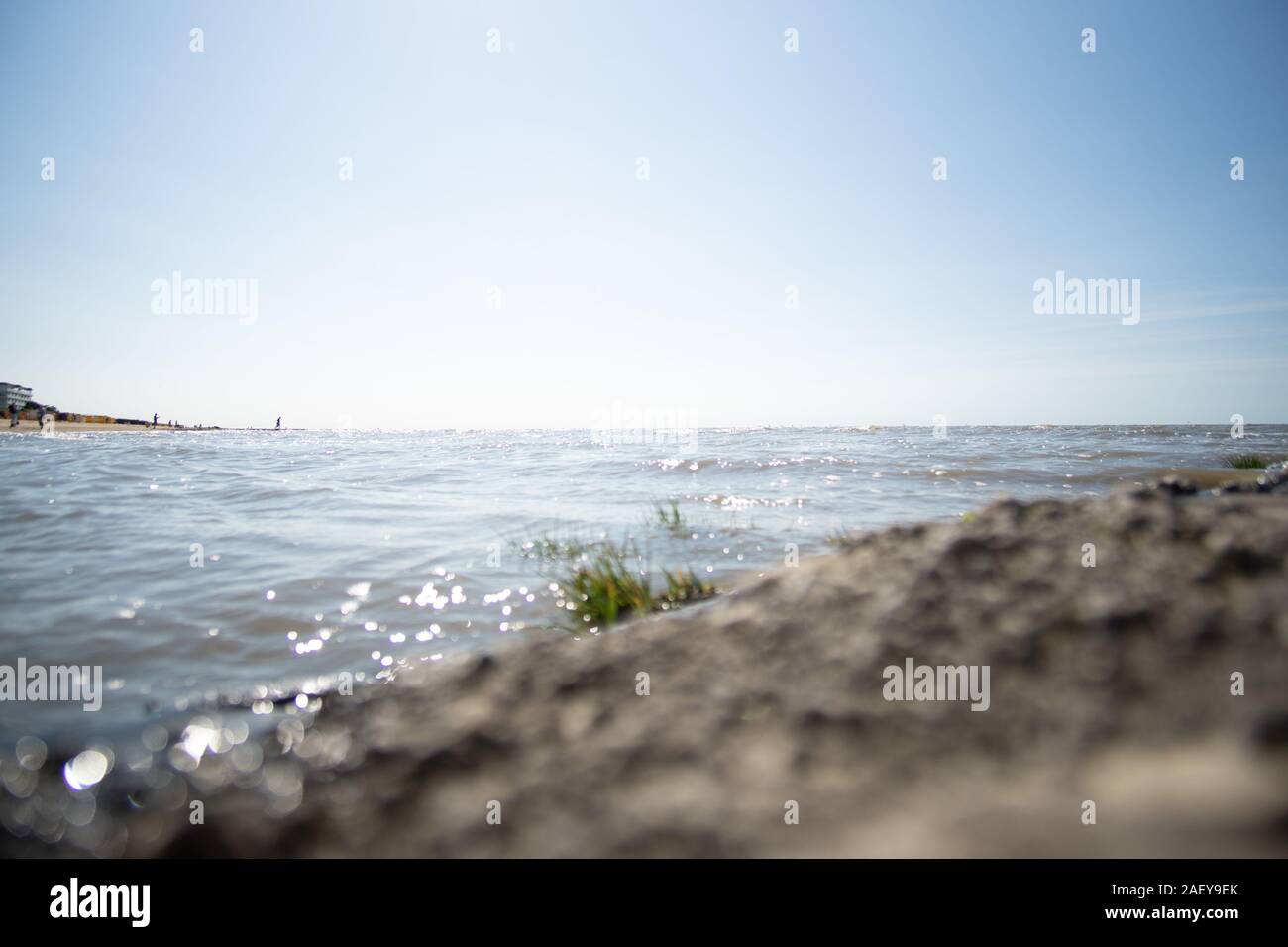 North Sea with blurry rocks in foreground Stock Photo - Alamy