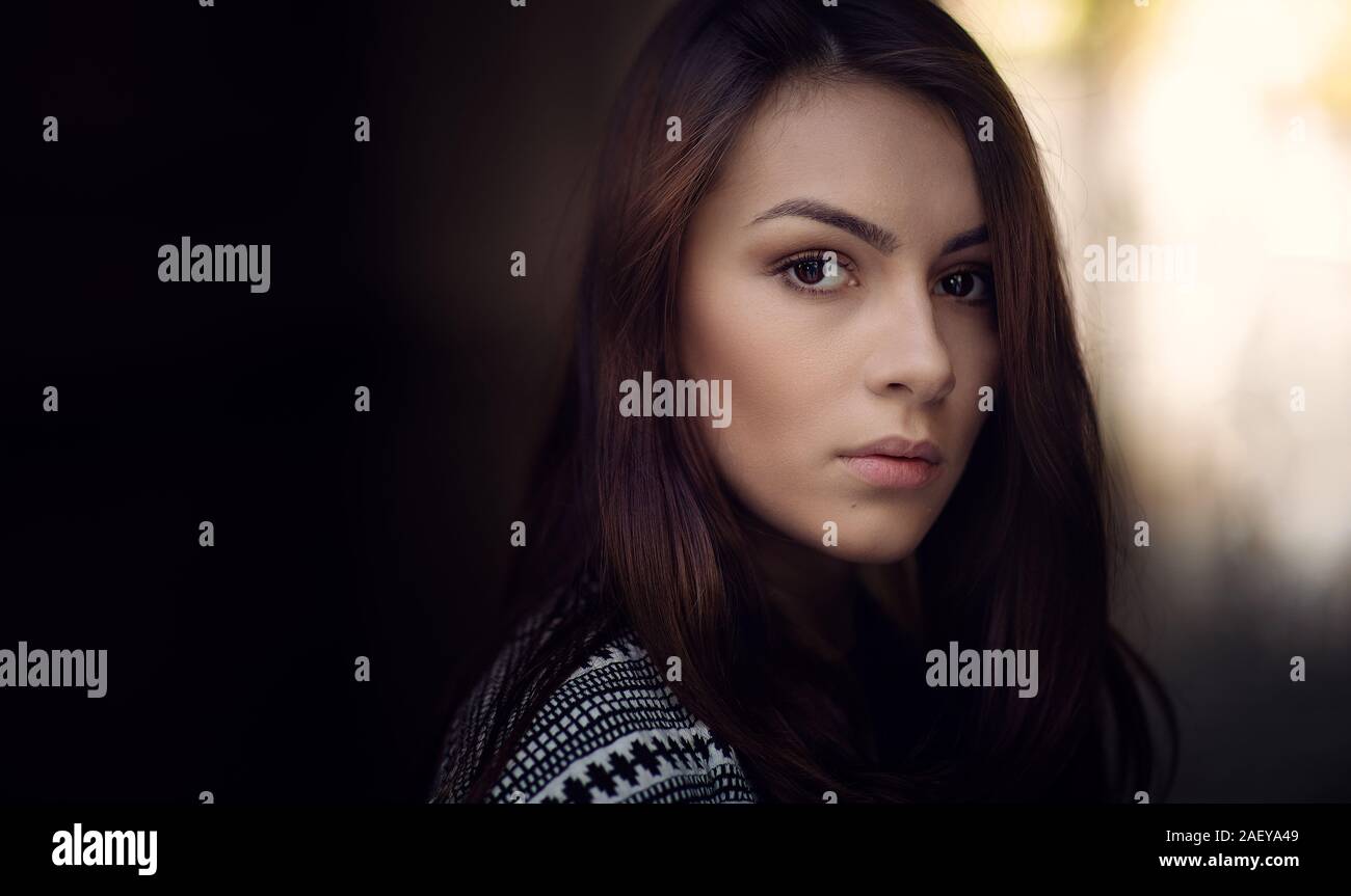 Lonely sad woman deep in thoughts looking behind Stock Photo - Alamy