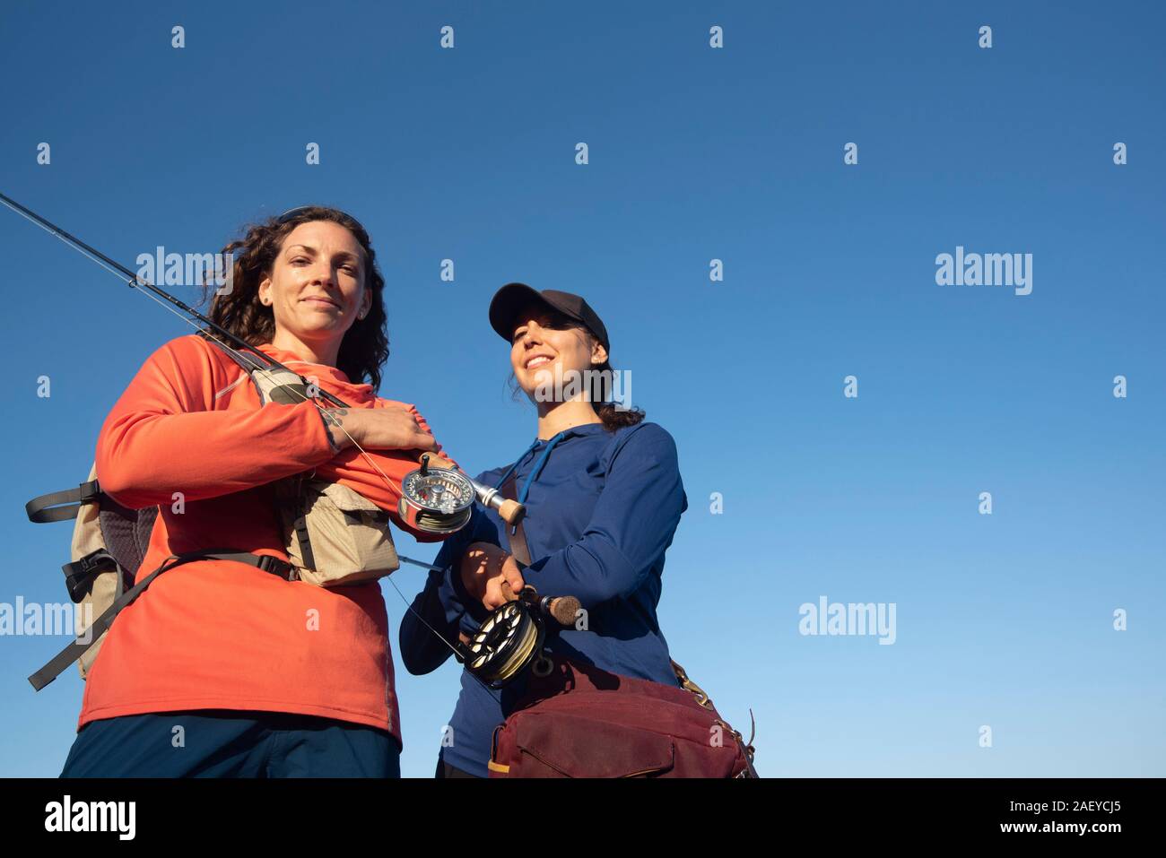 Portrait of two women fly fishing Stock Photo - Alamy