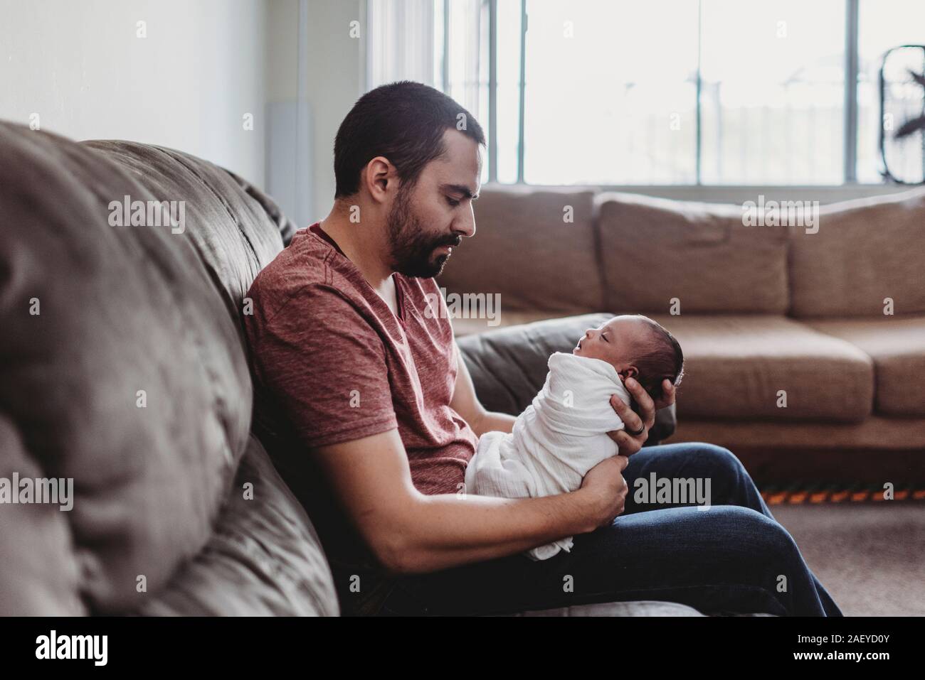 Mid-30â€™s dad with beard holding swaddled infant Stock Photo - Alamy