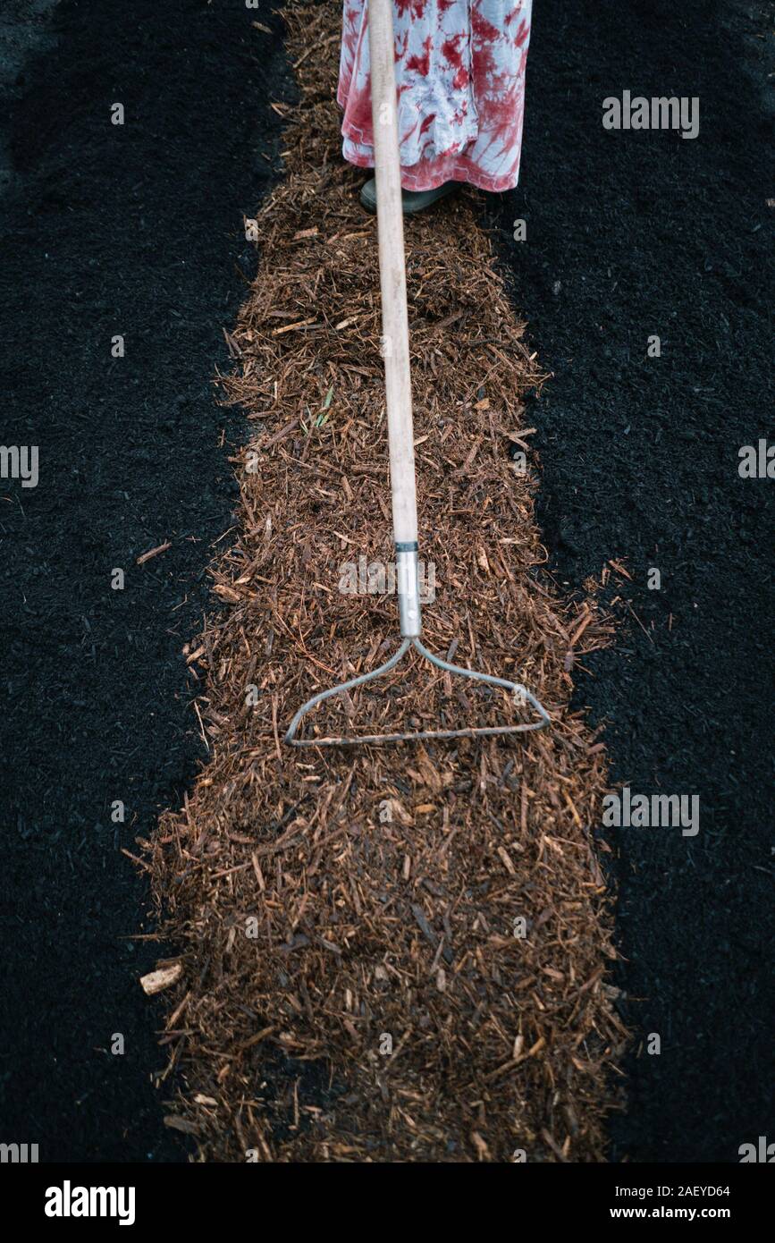 Raking dirt hi-res stock photography and images - Alamy