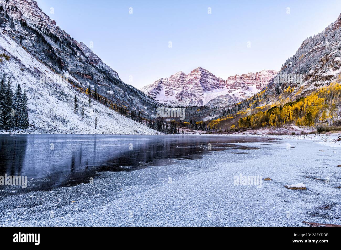 Maroon Bells sunrise reflection with pink sunlight on peak in Aspen ...