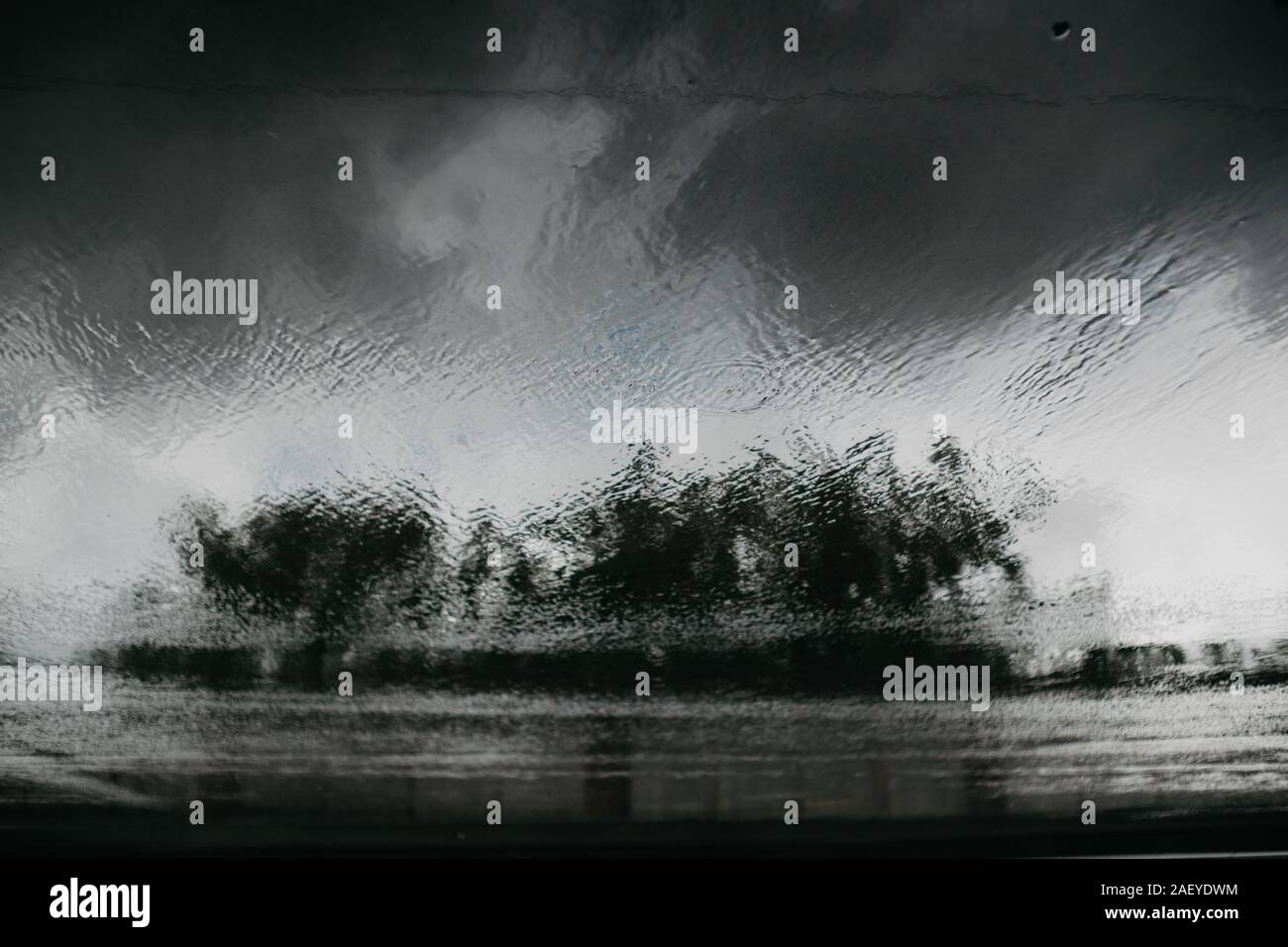 Reflection of trees on surface of rippled water Stock Photo - Alamy