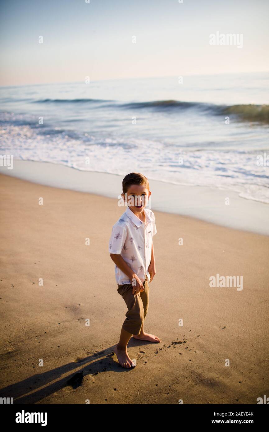 Boy at beach sunset hi-res stock photography and images - Alamy
