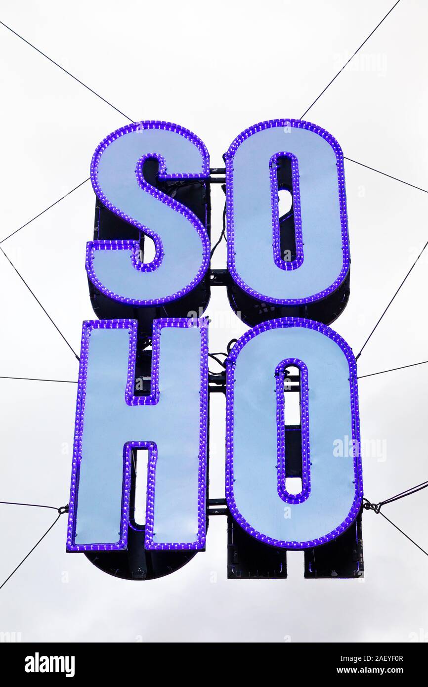 London, UK - 1st December 2019: Neon Soho sign suspended above a London ...