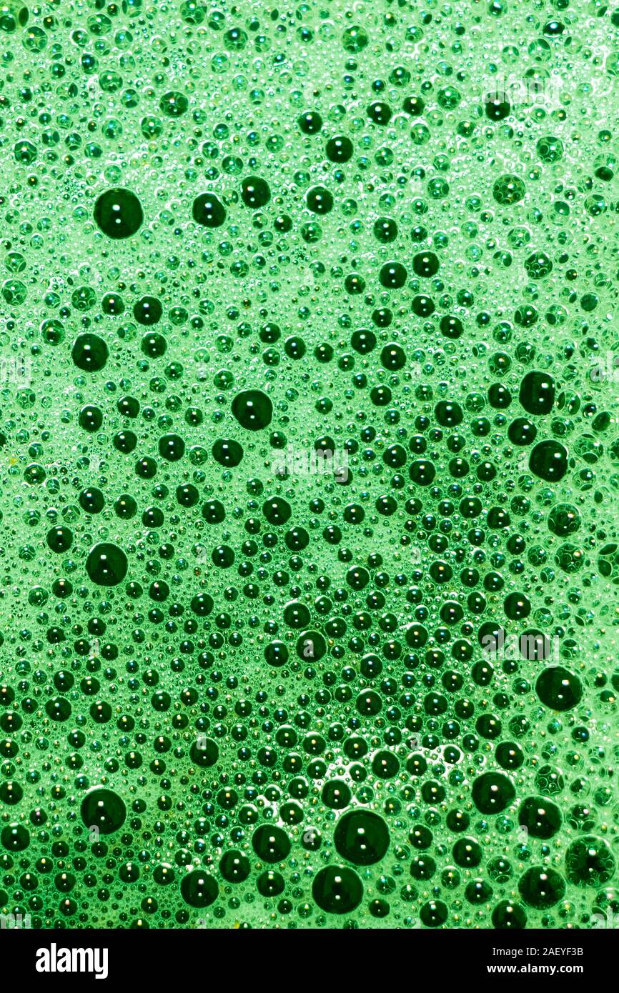 Abstract background and texture of green bubbles with light ...