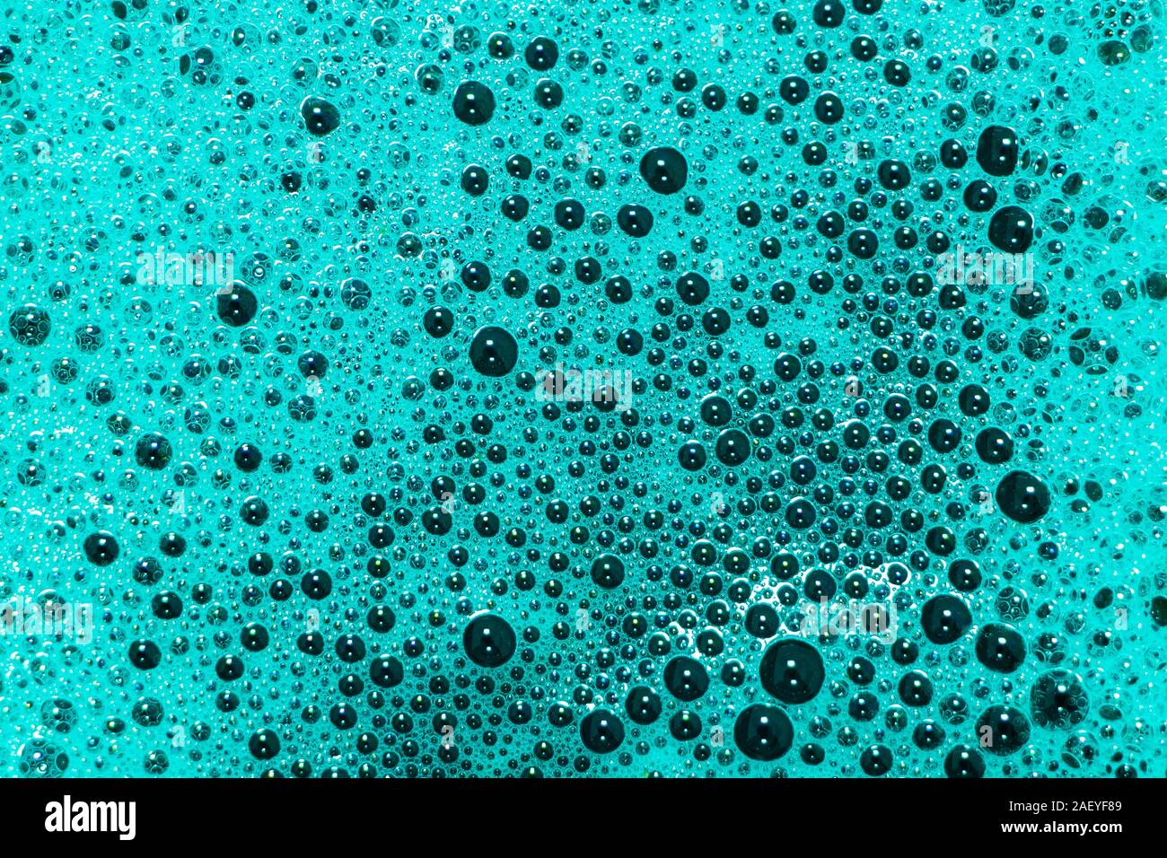 Abstract background and texture of blue bubbles with light illumination ...