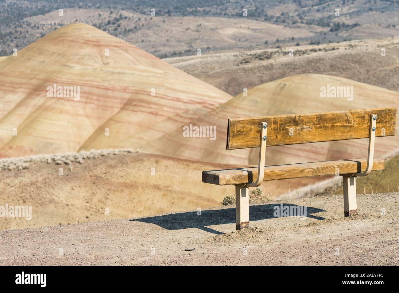 Detail of a bench facing the colorful landscape in Painted Hills ...