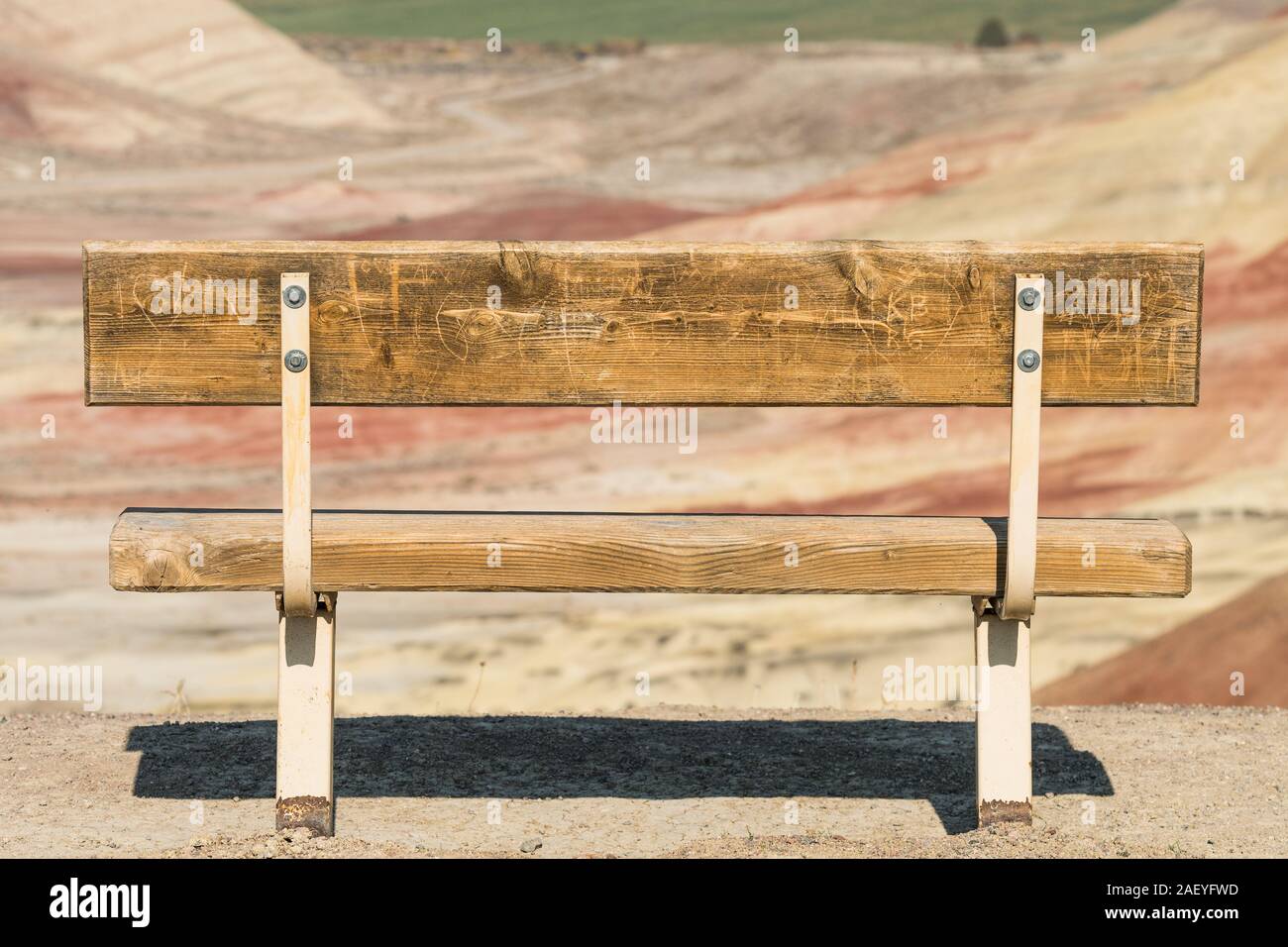 Detail of a bench facing the colorful landscape in Painted Hills ...