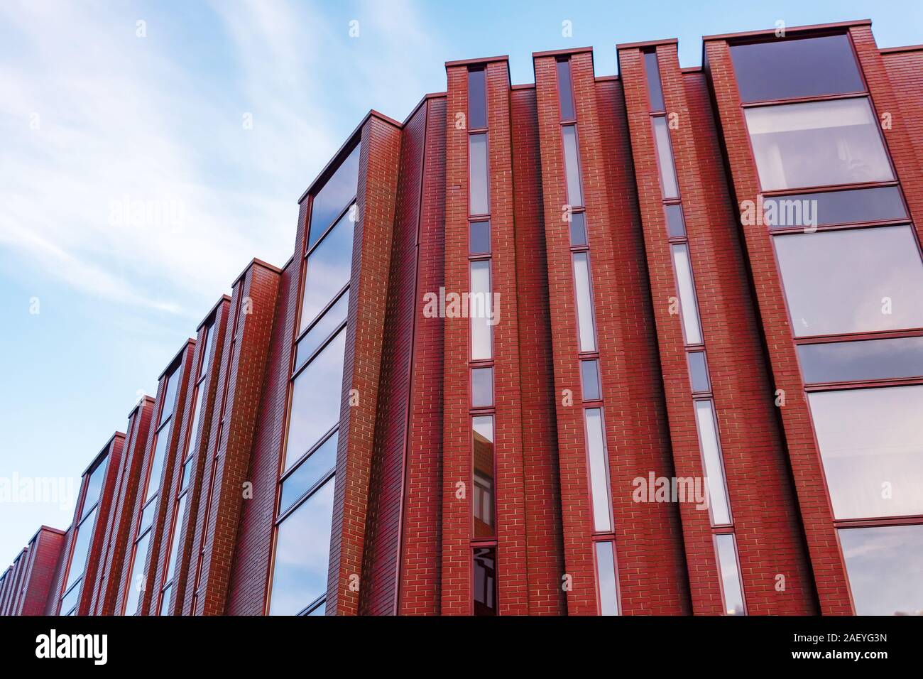 View of a new residential rectangular modern red brick house with ...