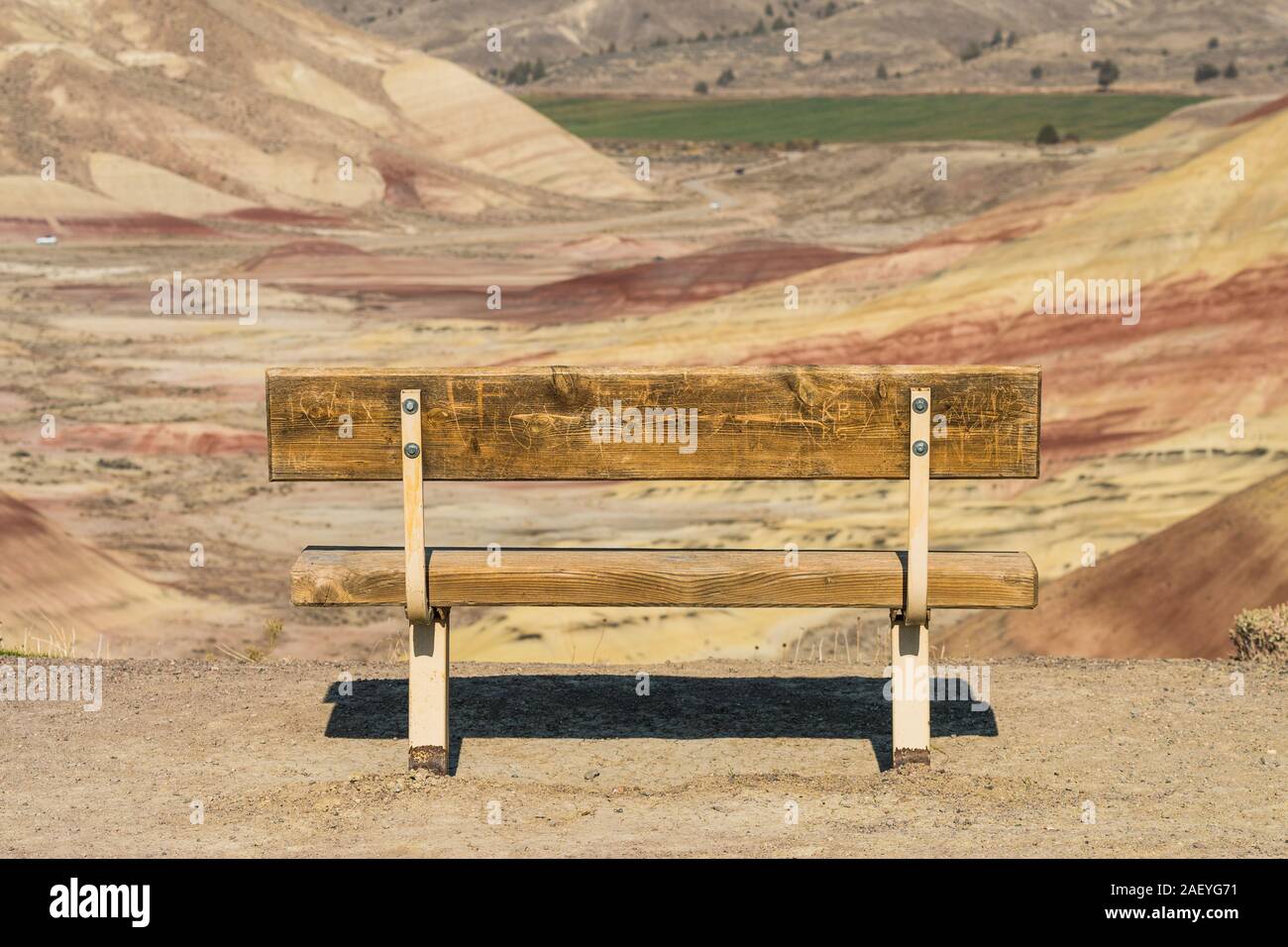 Detail of a bench facing the colorful landscape in Painted Hills ...