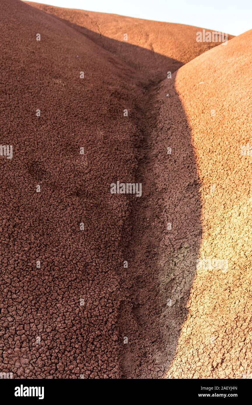 Detail of the red cracked soil of one of the mounds of Painted Hills ...