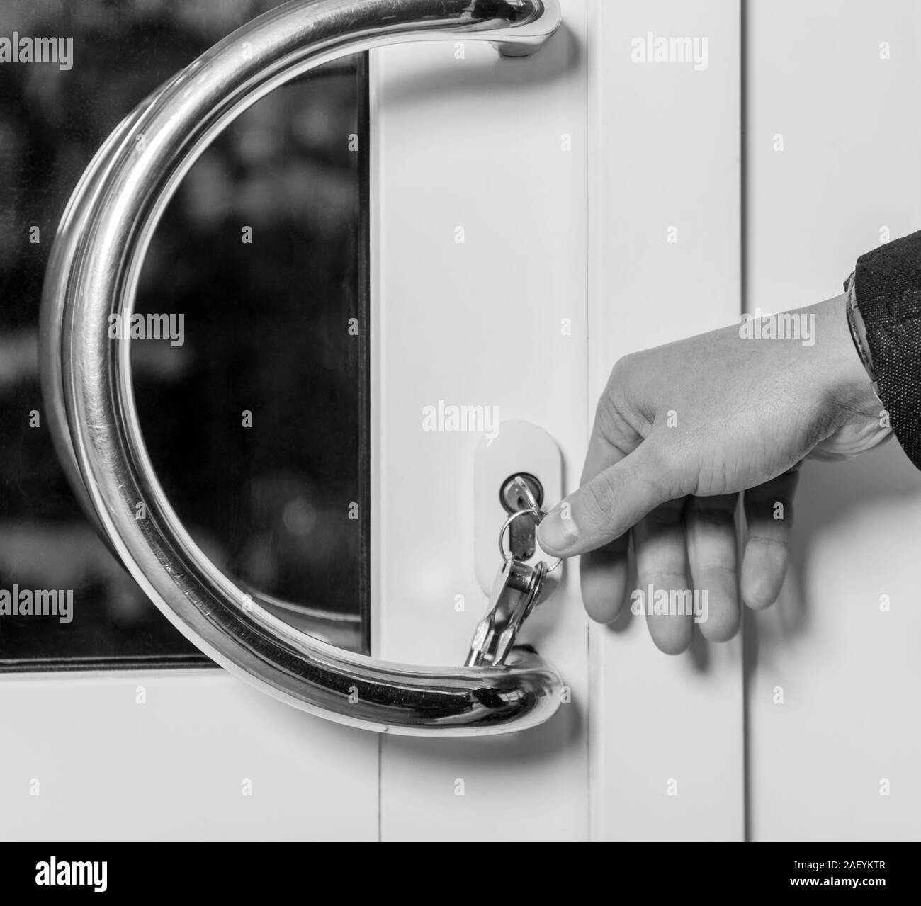Man opening the door with a key Stock Photo - Alamy