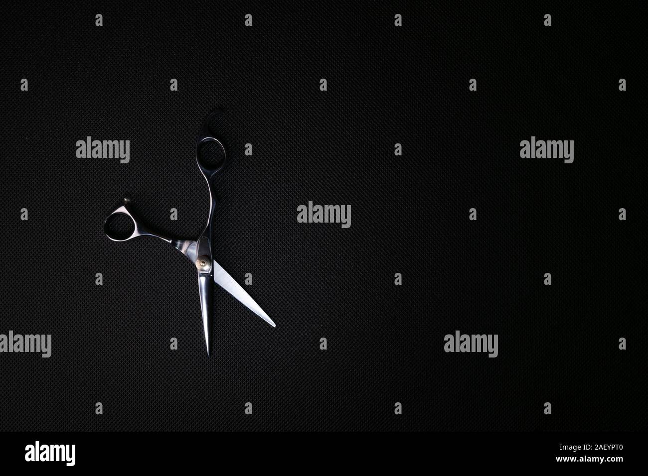 professional scissors on black background Stock Photo - Alamy
