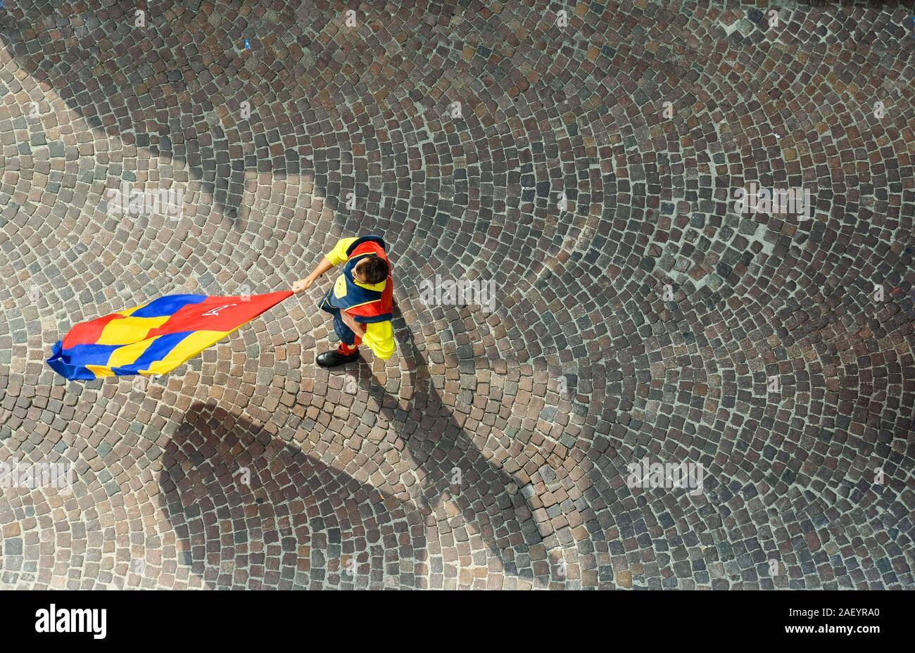 Directly above view of a young flag waver in the historical parade of ...