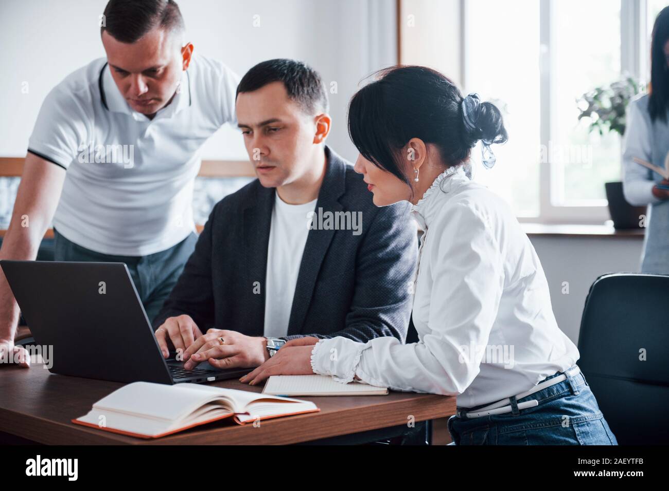 Giving advices. Business people and manager working on their new ...