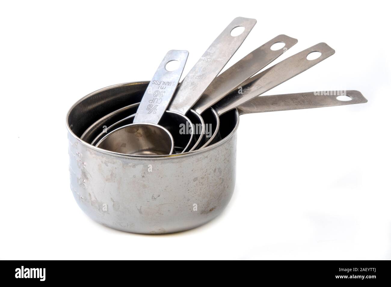 Old cooking measure on a white background Stock Photo - Alamy